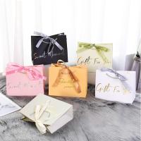 China Shopping Boutique Paper Gift Bags 300gsm With Bronzing Printed Logo Ribbon Handle for sale