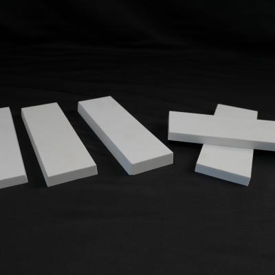 China Industrial-Grade Alumina Ceramic Tiles Durable with Hardness 9 On Mohs Scale and 2000 MPa Compressive Strength for sale