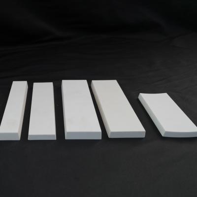 China High Thermal Shock Resistance Alumina Ceramic Tiles with Glossy Surface Finish and 130*50*15mm Size for sale