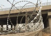 China 500mm Diameter BTO-28 Galvanized Concertina Razor Barbed Wire Coil with 0.5mm Blade Thickness and 2.5mm Core Wire for sale