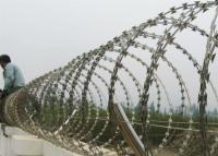 China BTO-22 Razor Barbed Tape Wire 2.5mm Hot Dipped Galvanized Security Fencing 450-980mm Diameter for sale