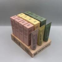 China Cosmetic Store Wood Display Holder Hand Cream Display Stand for sale