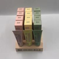 China Cosmetic Store Wood Display Holder Hand Cream Display Stand for sale