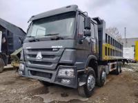 China Second Hand Tipper Trucks Black Color 371hp 8×4  HOWO ZZ3317 Flat Roof Cabin Rated Load 15.5t for sale