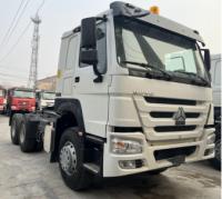 China Used Diesel Trucks White Color 6×4 Drive Model Weichai Engine 430hp 12 Gears Standard Cabin Howo Tractor for sale