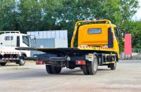 China Flat Bed Car Trailer Trucks Howo 4*2 Small Towing Truck Single Cab Loading 2 Tons LHD/RHD for sale