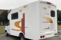 China Box Truck Container Wuling Motor Home Car 5.8 Meters With Toilet Comfortable Bed And Sofa for sale