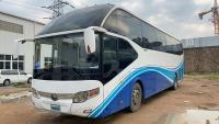 China 55 Seats 6 Tire 6050mm Wheelbase Used Yutong Buses Left Hand Drive Nude Packing Double Doors with ABS for sale