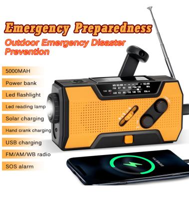 China Outdoor Camping Equipment Portable 5000mAh Crank Radio NOAA Weather AM FM Band SOS Alarm with Reading Lamp for sale