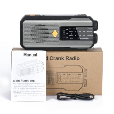 China Portable IPX4 2000mAh Rechargeable Power Bank Emergency Radio Solar Radio Dynamo Crank with Flashlight and Reading Lamp for sale