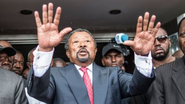 Jean ping outside his party headquarters