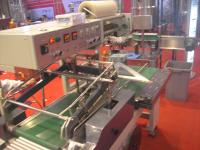 China Environmental Shrink Film Automated Packaging Machine With Touch Screen for sale