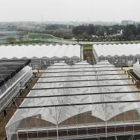 China Tropical Plastic Film Multi-Span Poly Tunnel Greenhouse With Enhanced Cooling Systems for sale
