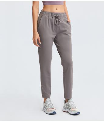 China New Nude Loose Yoga Pants Elastic Draw Rope Straight Leg Casual Fitness Pants for Women for sale