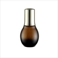 China 30ml 50ml Amber Spherical Glass Bottle with Gold Switch Dropper Cap for Massage Oil and Cosmetics for sale