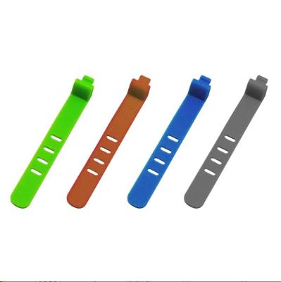 China MVQ Custom Moulding Silicone Rubber Molded Part for Multifunctional Adjustable Cable Band for sale