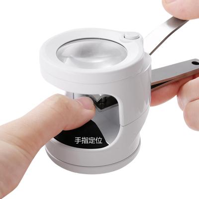 China Desktop Magnifier With LED Light Safety Portable Sharply Baby Nail Clipper Magnifier for sale