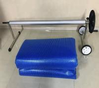 China 9M * 15M Swimming Pool Solar Cover Anti - UV Waterproof Heat Retention Automatic Swimming Pool Cover for sale