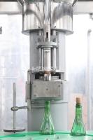 China Automatic Wine Glass Bottle Wooden Corking Machine 1500-1800 bph Capacity with PLC Control for 65-100mm Diameter Bottles for sale