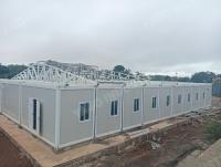 China Galvanized Light-Steel Framework Prefabricated Container Building with Fire-Retardant Fiberglass Sandwich Panels in 20-Foot Standard Flat-Pack Module for Temporary Worker Housing for sale
