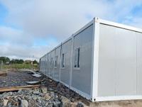 China Galvanized Light-Steel Framework Prefabricated Container Building with Fire-Retardant Fiberglass Sandwich Panels in 20-Foot Standard Flat-Pack Module for Temporary Worker Housing for sale