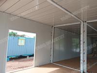China Modular Flat Pack Container with Q235 Galvanized Steel Profile and 75mm Fire-Retardant Rock-Wool Sandwich Panel for Temporary Construction Camp Worker Living Quarters for sale