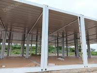 China Modular Flat Pack Container with Q235 Galvanized Steel Profile and 75mm Fire-Retardant Rock-Wool Sandwich Panel for Temporary Construction Camp Worker Living Quarters for sale