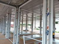 China Modular Flat Pack Container with Q235 Galvanized Steel Profile and 75mm Fire-Retardant Rock-Wool Sandwich Panel for Temporary Construction Camp Worker Living Quarters for sale