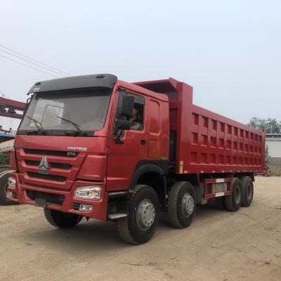 China Sinotruk 12 Wheeler Used HOWO 70 Ton 100 Ton Dump Truck 8X4 with Radial Tire Design for sale