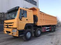 China Cnhtc HOWO Sinotruk 8X4 Dump Truck/Tipper Truck/Heavy Duty Truck with 300L Fuel Tanker for sale