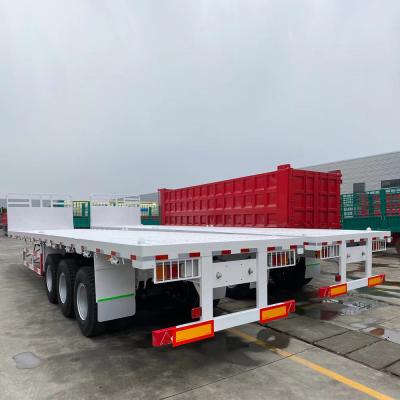 China Double Axles 3 Axle Flatbed Semi Trailers with One Piece Tool Box and Jost Support Leg for sale