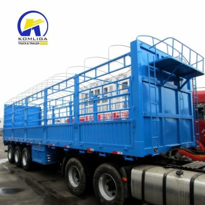 China 3 Axles Flatbed Cargo Stake Semi Truck Trailer Customized Request 315/80r22.5.12r22.5 for sale