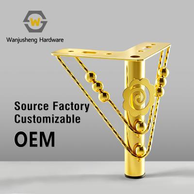 China Heavy-Duty Furniture HardwarecHollow Floral Gold Sofa & Cabinet Legs with Three-Prong Steel Ball Feet and Anti-Slip Bottom Pads for sale