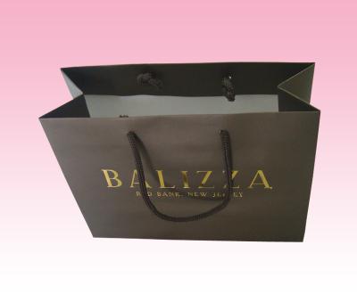 China custom luxury paper packaging bags with hot stamping embossed logo manufacturer for sale