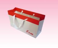China custom luxury paper gift bag factory with embossed red hot stamping logo for sale