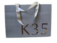 China custom decorative gray paper retail bags wholesale with green hot stamping logo for sale