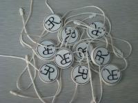 China custom wholesale garment plastic hang tag manufacturer with emboss black logo for sale