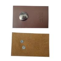 China custom leather labels for hats garment leather tags wholesale with metal logo for sale
