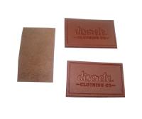 China custom clothing tag leather hang tag leather badge holder with eyelet supplier for sale