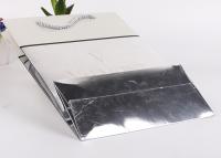 China Custom Printed Luxury Silver Paper Carrier Bags with Embossed Logo Suppliers for sale