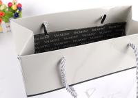 China Custom Printed Luxury Silver Paper Carrier Bags with Embossed Logo Suppliers for sale