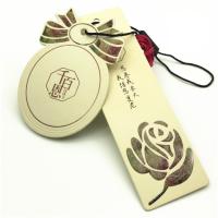 China Luxury Clothing Paper Hangtag Printing with Emboss Silver Foil UV Logo Maufacturer for sale