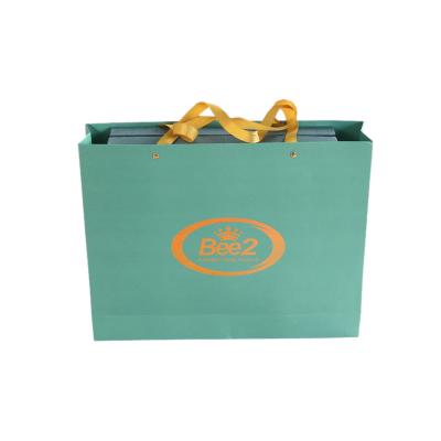 China Custom Printed Promotional Paper Gift Packaging Bags Wholesale with Hologram Logo for sale