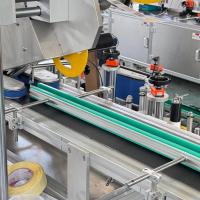 China High Precision Automatic Garment Labeling Machine PLC Control With Stainless Steel Construction for sale