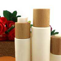 China Custom Round Cosmetic Bottle Caps Non Spill Cream Bottle Wooden Lid for sale