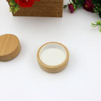 China Custom Round Cosmetic Bottle Caps Non Spill Cream Bottle Wooden Lid for sale