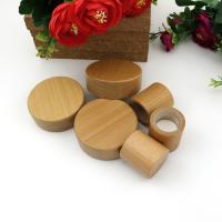 China Custom Round Cosmetic Bottle Caps Non Spill Cream Bottle Wooden Lid for sale