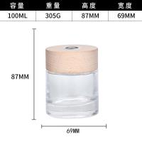 China 100ML Round shaped Reed Diffuser Glass Bottles with Beech wooden round lid for living Room for sale