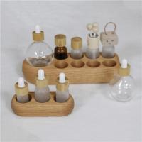 China Newest Wood Essential Oil Bottle Display Stand Customized Wood base Solid Wood Oval shape Holder for sale