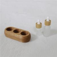 China Newest Wood Essential Oil Bottle Display Stand Customized Wood base Solid Wood Oval shape Holder for sale